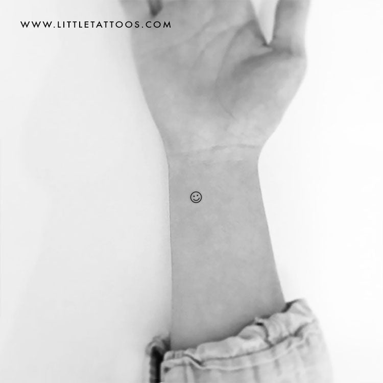 Tiny smiley face tattoo | Orangetattooshop.com